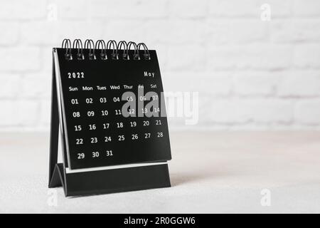 Flip calendar for May on light background Stock Photo - Alamy