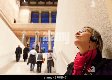 Visitor with audio guide inside of the Neues Museum (New Museum ...