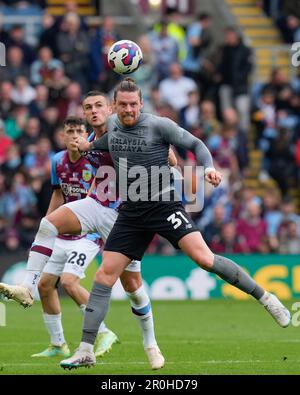 Taylor Harwood-Bellis #5 of Burnley competes for the ball with Mallik ...