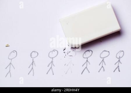 Cancellation culture concept. The drawn figure of a person is erased ...
