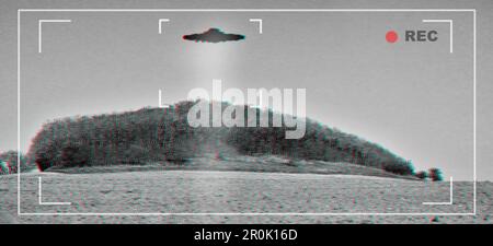 UFO, alien and camcorder on a camera display to record a flying saucer ...