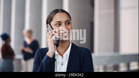 I make sure my clients are happy. a young businesswoman talking on her ...