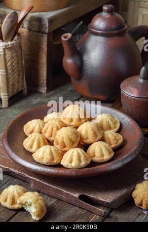 Kueh Bolu or Kuih Bahulu is a sponge cake. Asian traditional food is ...