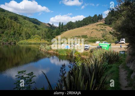 Lake at Gabriel's Gully camp site, near Lawrence, Otago, South Island ...