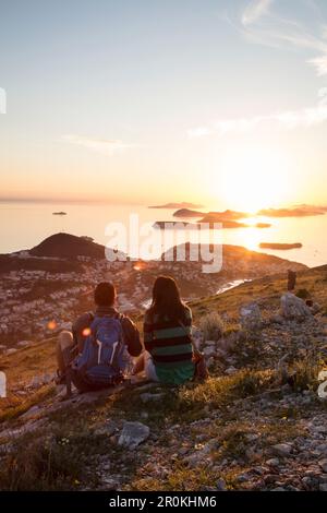 Couple admires view across Lapad Peninsula and islands seen from ...