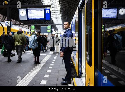 AMSTERDAM - A conductor of the new Sprinter at Amsterdam Central. A ...