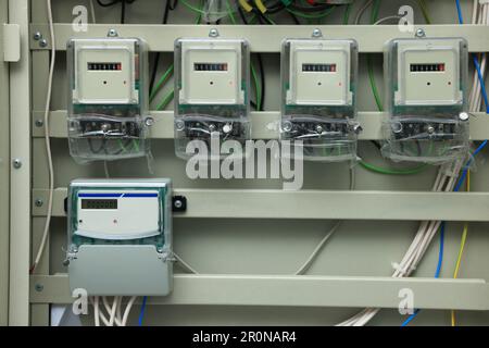 Electric meters and wires in fuse box Stock Photo - Alamy