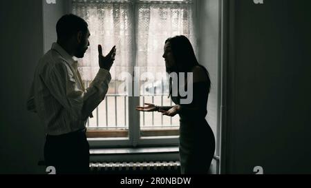 Dramatic couple shouting and yelling at each other. A young Middle ...