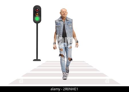 Bald rocker man in a denim vest posing and gesturing rock and roll sign ...