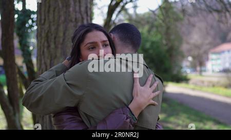 Loving boyfriend providing comfort to his grieving girlfriend during a ...