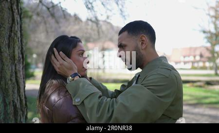 Loving boyfriend providing comfort to his grieving girlfriend during a ...