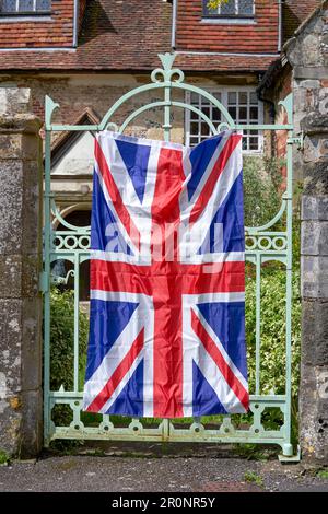 British Union Jack flag draped over a metal gate as part of the ...