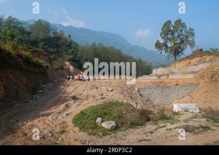 High altitude playground and stadium is being made by cutting tree and ...