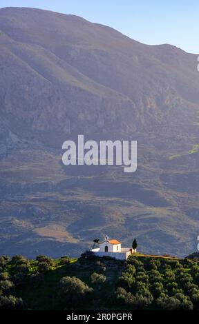 Little chapel with mountains of southern Crete Stock Photo - Alamy