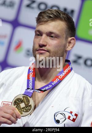 Nils Stump of Switzerland celebrates during an award ceremony of men's ...