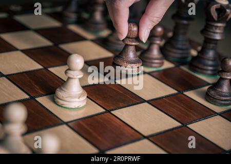 Close up of a person responding with the most common move e5 to the e4 ...