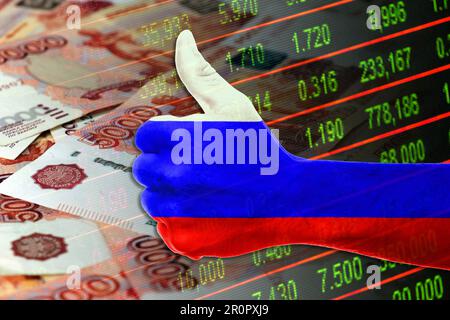 Economy graph: thumb up with Russia flag, stock market indicators and ...