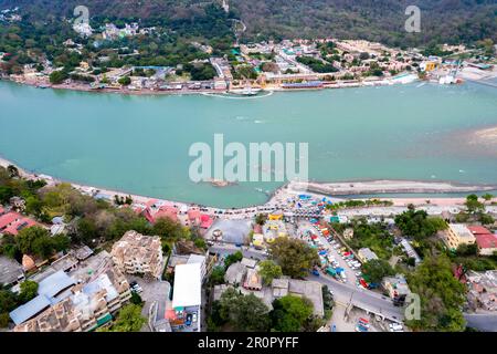 aerial drone shot over ram setu jhula suspension bridge with temples on ...
