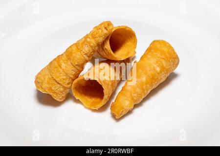 Traditional party snack known as "canudinho"or "tatu tail". Stuffed ...