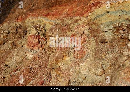 Limestone lying under a layer of variegated clay. Lower section of the ...