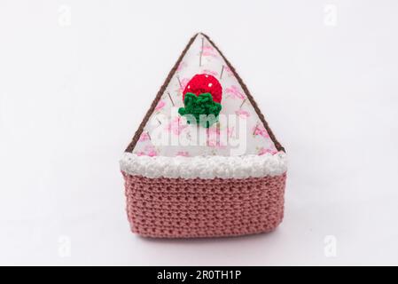 Chocolate and raspberry cake pincushion with a strawberry on top Stock ...