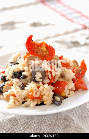 Tomato - risotto with olives Stock Photo - Alamy