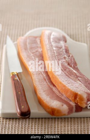 Smoked pork belly bacon block. Black background. Top view Stock Photo ...