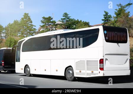Modern white bus on road outdoors. Public transport Stock Photo - Alamy