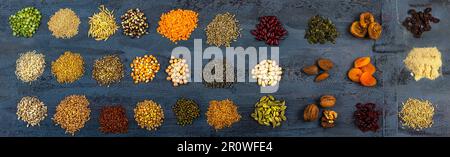 Different types of nuts, seeds and dried fruits on black background ...