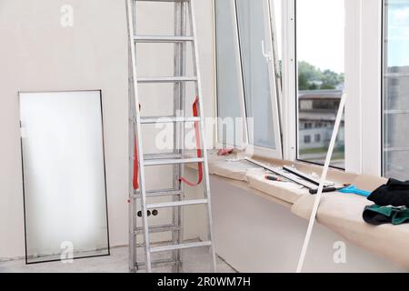 Double glazing window and folding ladder indoors Stock Photo - Alamy