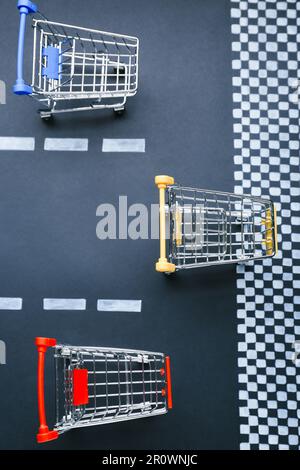Competition concept. Shopping carts racing towards finish line Stock ...