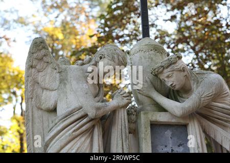 Beautiful statues of angels at cemetery. Religious symbol Stock Photo ...