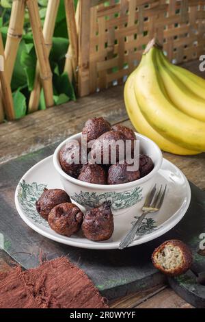 Malaysian fritter snack deep fried banana balls or Malay as Cekodok ...