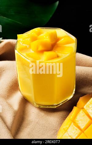 Ripe yellow mango on rustic wooden background Stock Photo - Alamy