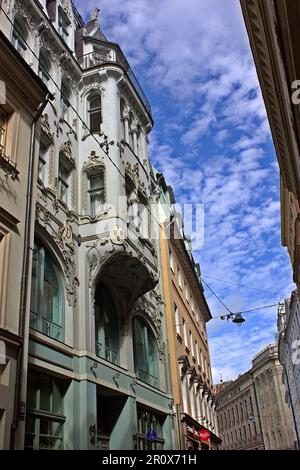 A stunning image of a tall, imposing building illuminated by the night ...