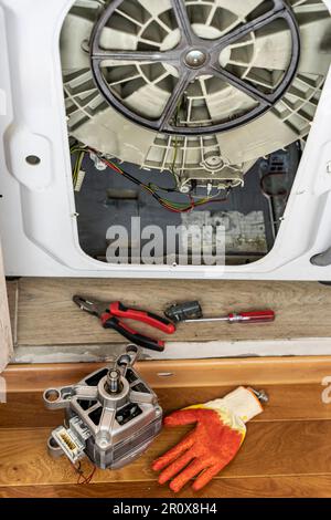 process of repairing the electric motor of a washing machine Stock ...