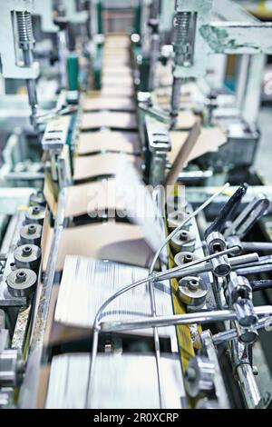 The printing assembly line. Detail shot of the workings of a printing ...