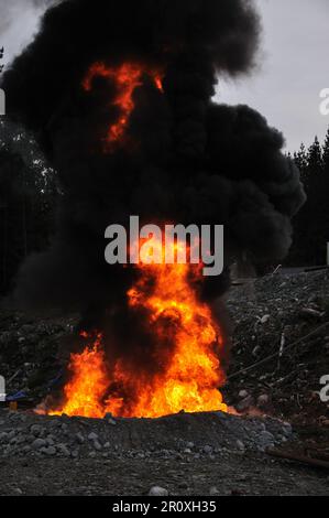 a wall of flame at an oil well flare Stock Photo - Alamy
