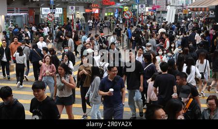 Shoppers walk along Sai Yeung Choi street in Mong Kok during the Easter ...
