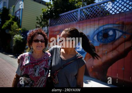 Miranda Bergman (l to r), talks with fellow muralist, Lucia Ippolito on ...