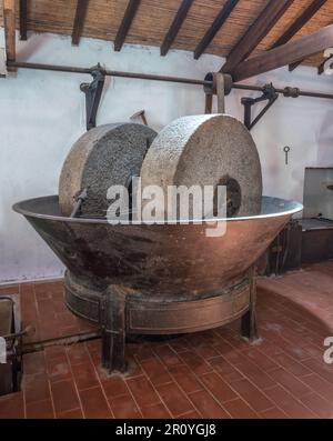 Olive oil press is installed in premises of the ancient equipment for ...