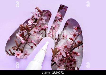 Nasal drops with blooming branches visible through cut lilac paper ...