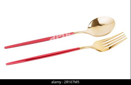 Golden spoon and fork with red handles on white background Stock Photo ...