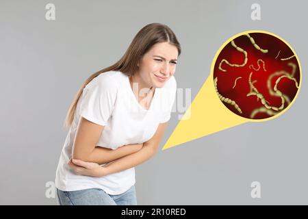 Parasites under microscope and woman suffering from helminthiasis Stock ...