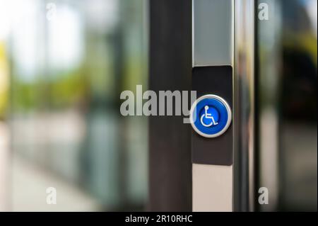 Blue bell button for people with disability Stock Photo - Alamy