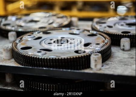 Car engine flywheels on shelf at auto production factory Stock Photo ...