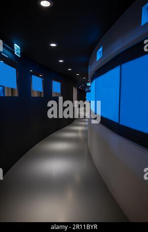 Illuminated Corridor with TV Screens in Switzerland Stock Photo - Alamy