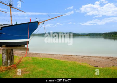Square rig ship bow framing scene across bay Stock Photo - Alamy