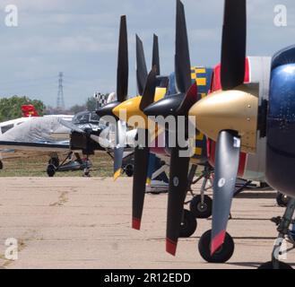 A close up image of a parked airplane's front propeller, showing the ...