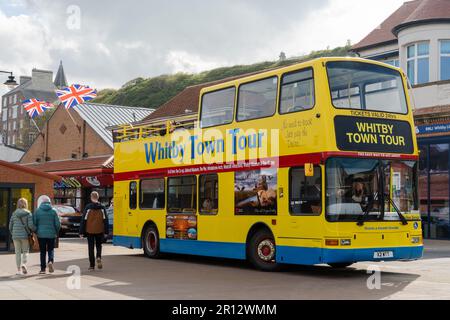 The yellow Whitby Town Tours open top bus, to take visitors around the ...